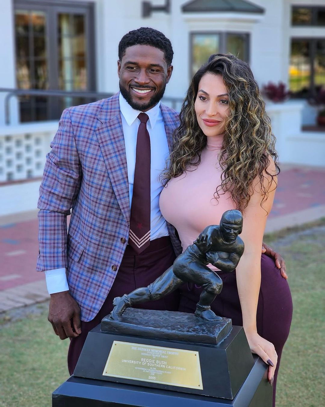Ex-NFL RB Reggie Bush And Wife Lilit Bush Pose With His Heisman Trophy ...